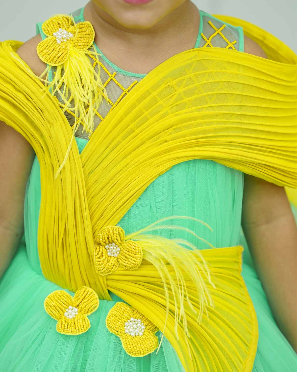 Aqua green and light mango yellow layered frilled gown with stylish pi ...