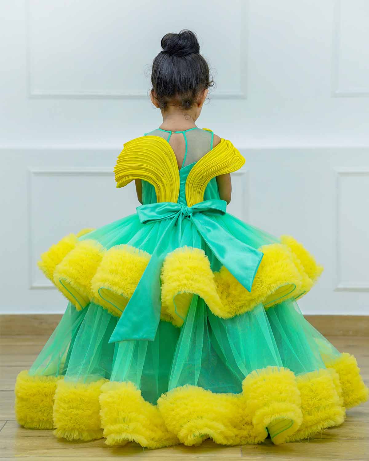Aqua green and light mango yellow layered frilled gown with stylish pi ...