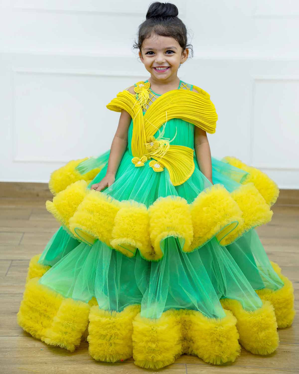 Aqua green and light mango yellow layered frilled gown with stylish pi ...